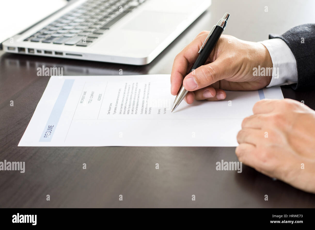 Close-up Businessman or job seeker signing on resume form Stock Photo ...
