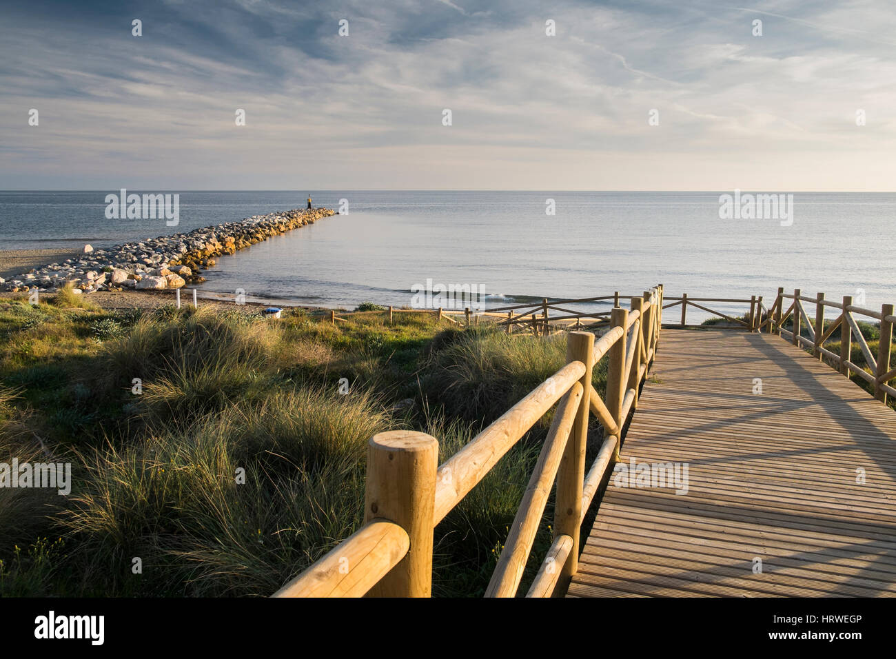 Sunset from wooden path in the natural park of Cabopino, Marbella ...