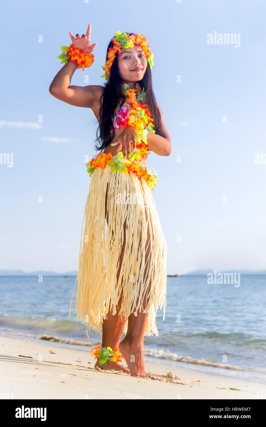 Hula Hawaii dancer dancing on the beach with horizon of sea. Ethnic ...