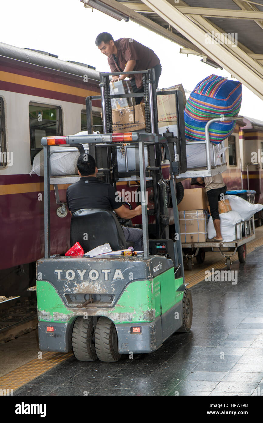 Men loaded packages into the train through the window of the car ...