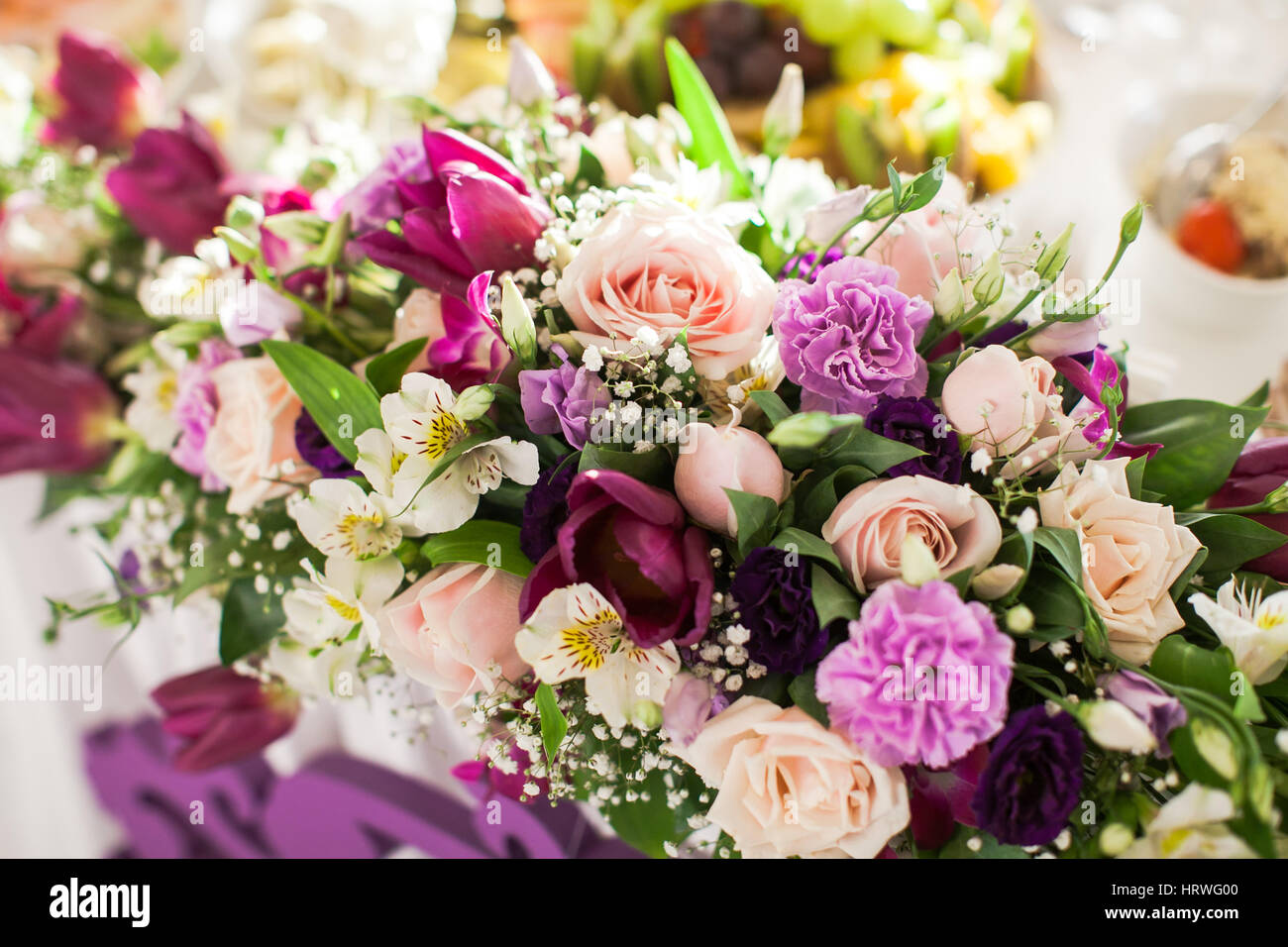 Flower composition on a table. Wedding decor. Beautiful bouquet of ...