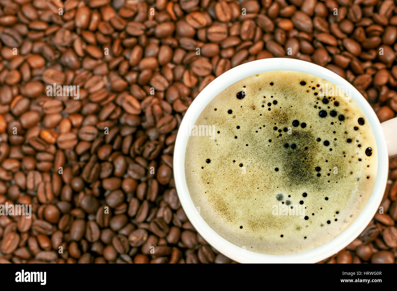 Coffee bean background with cup of fresh hot coffee close Stock Photo ...