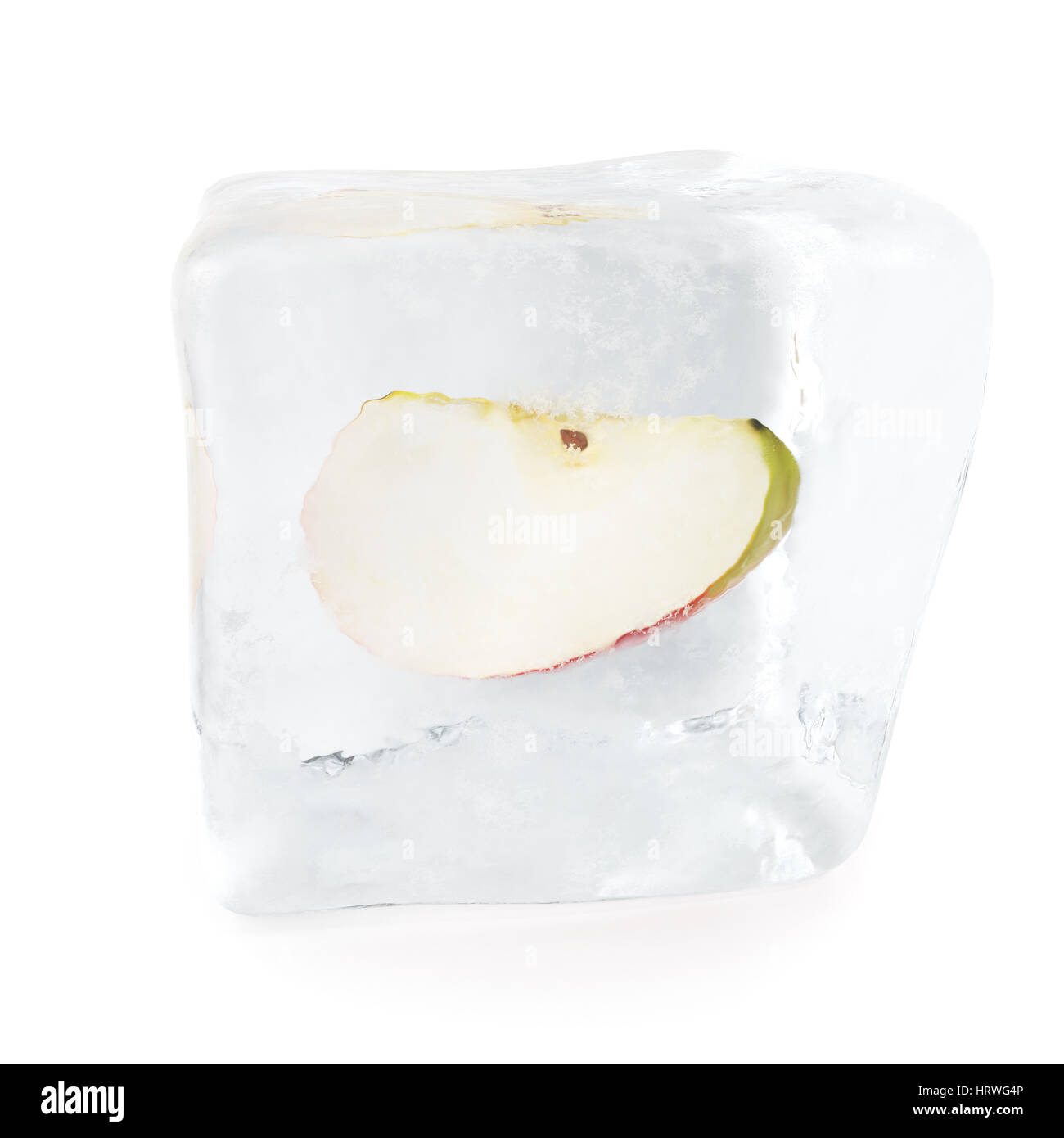 Slice Apple frozen in ice cube, ice cube in front, single ice cube ...