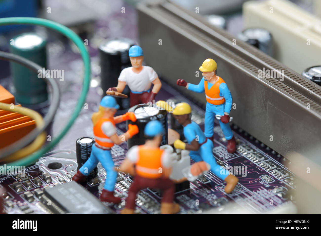 Selective focus of miniature engineer and worker fixed chip and ...