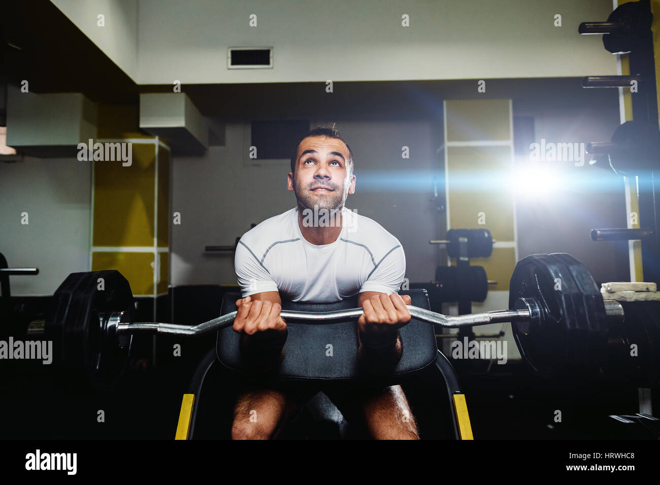 bodybuilder pumping up hands in gym. Gym work out Stock Photo - Alamy