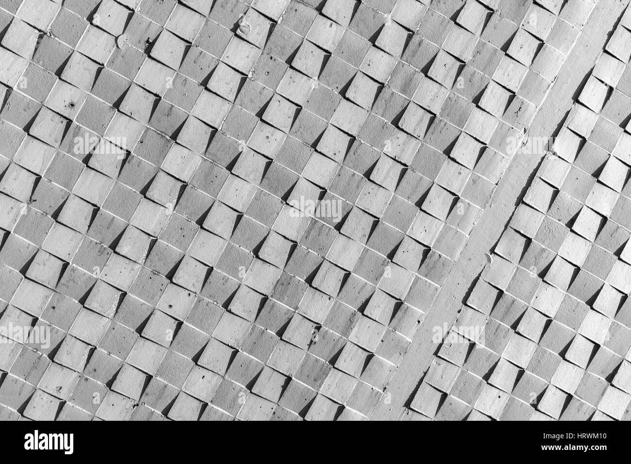 Gray concrete wall with abstract square relief pattern, background ...