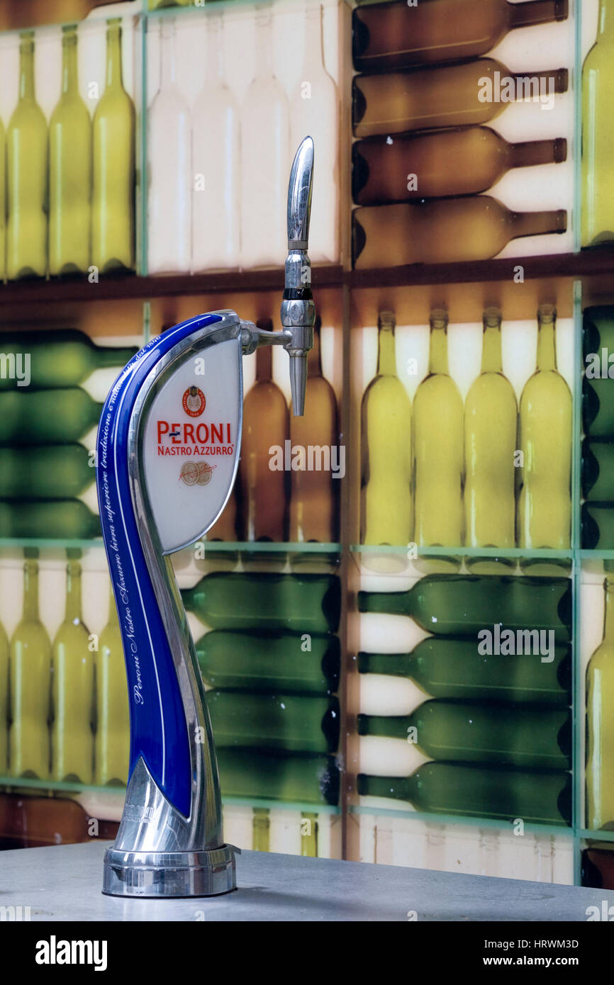 Draft beer dispenser and wine bottles Stock Photo - Alamy