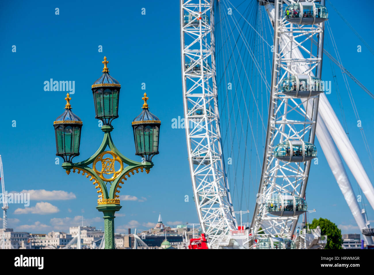 The london eye from Westminster bridge with the street lamp on the ...
