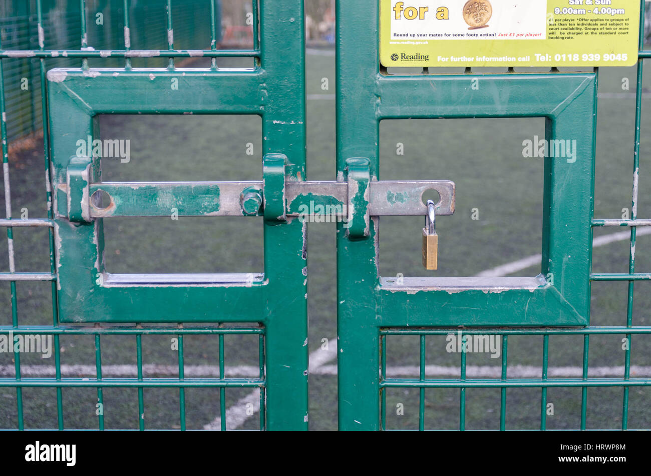 A latch to secure metal gates on the entrance to an outdoors 5-a-side ...