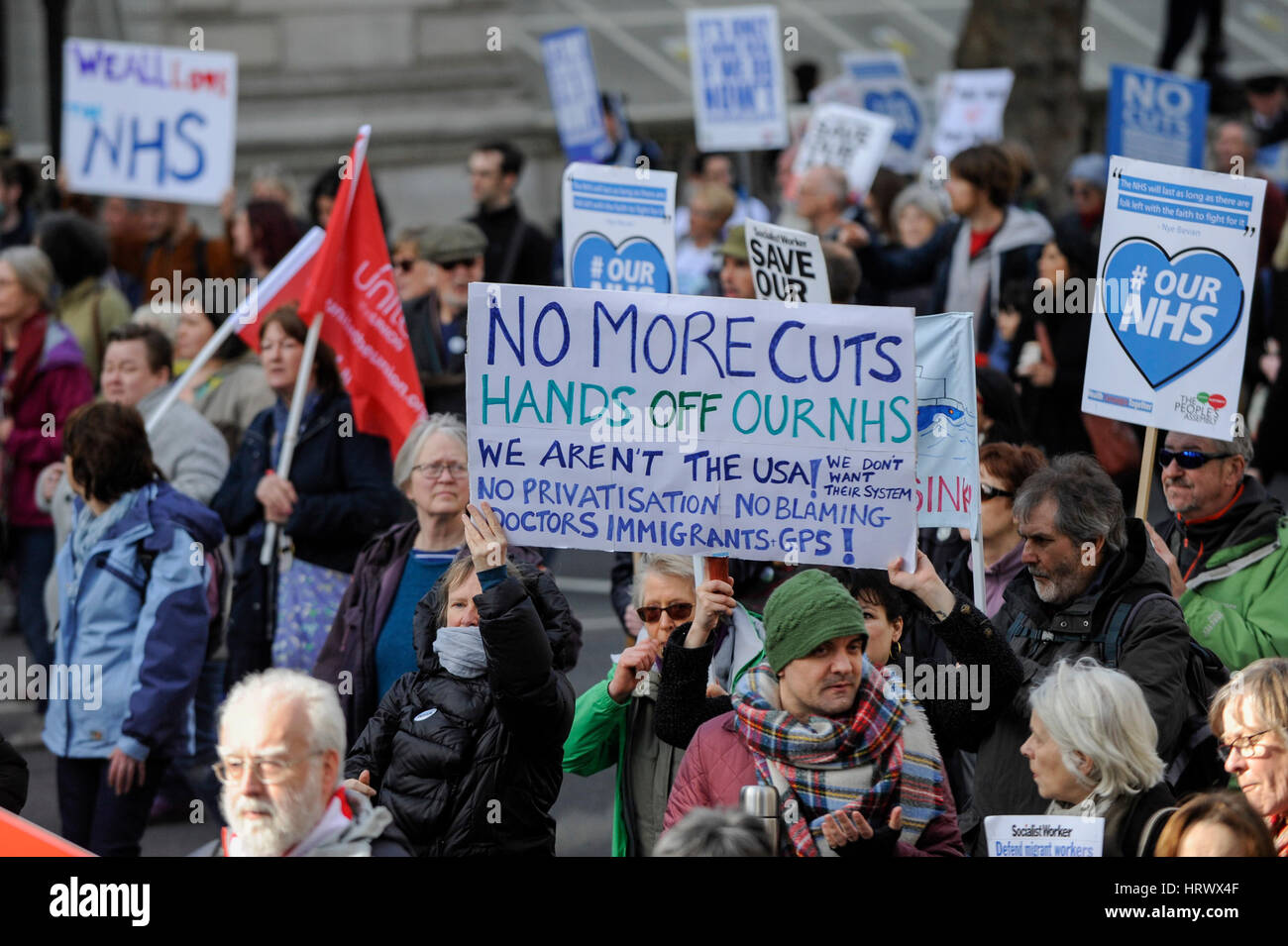 Carrying placards signs hi-res stock photography and images - Alamy