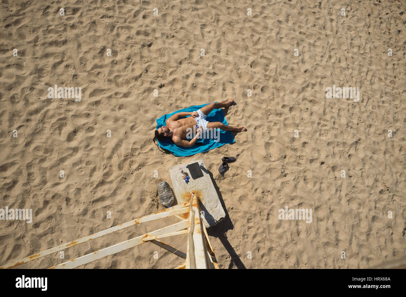 Beirut,Lebanon. 5th March 2017. A man sunbathes at the beach in Beirut ...