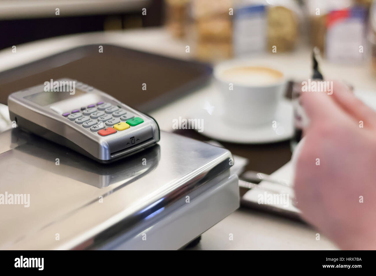 Paying for coffee in cafe Stock Photo - Alamy