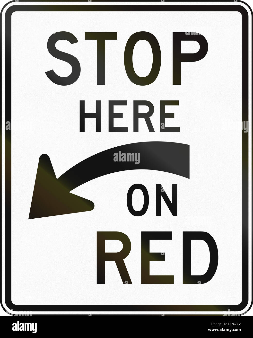 United States MUTCD regulatory road sign - Stop here on red Stock Photo ...