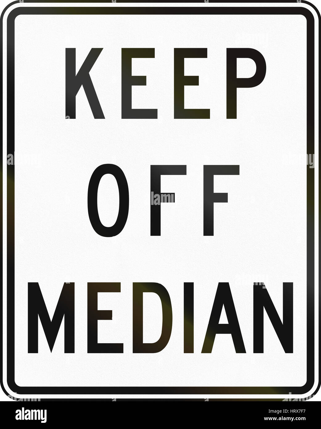 United States MUTCD regulatory road sign - Keep off median Stock Photo ...
