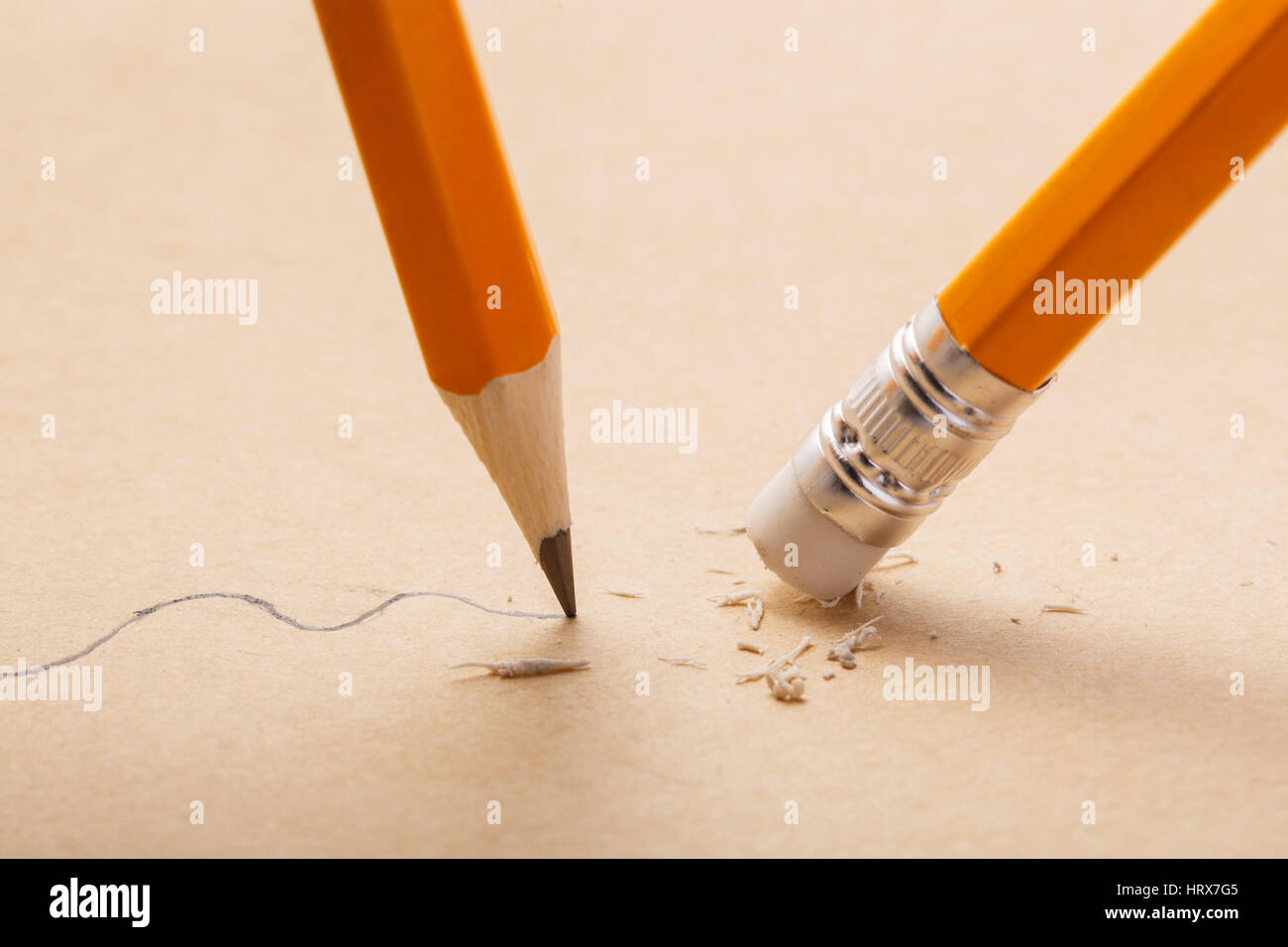 pencil draw a wavy line on paper and pencil eraser removing stripe ...