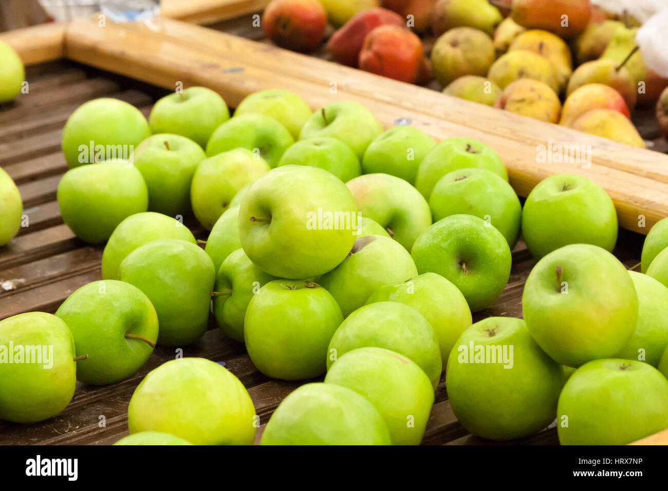 beautiful green apples on a counter of shop Stock Photo - Alamy