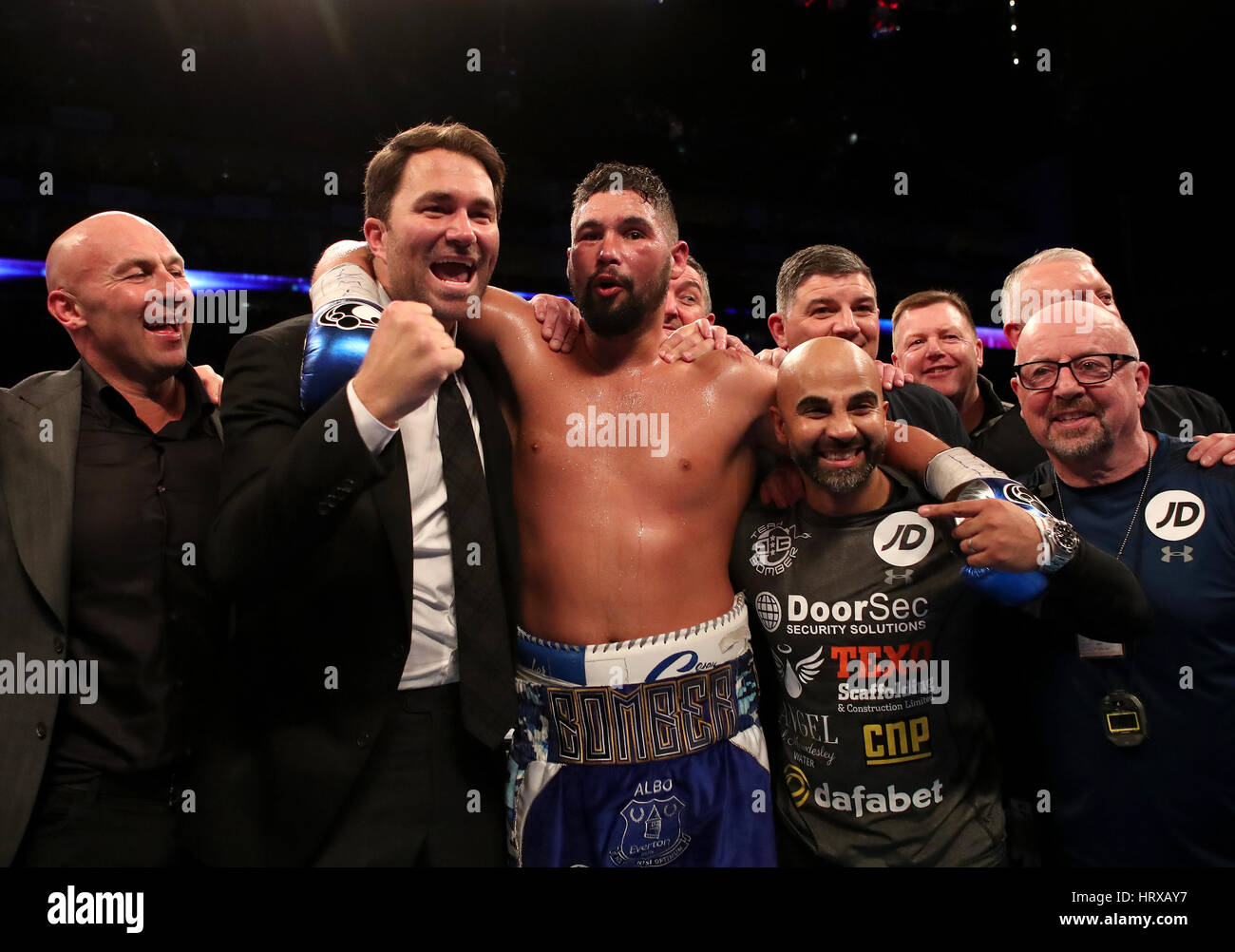 Tony Bellew celebrates victory over David Haye alongside promoter Eddie ...