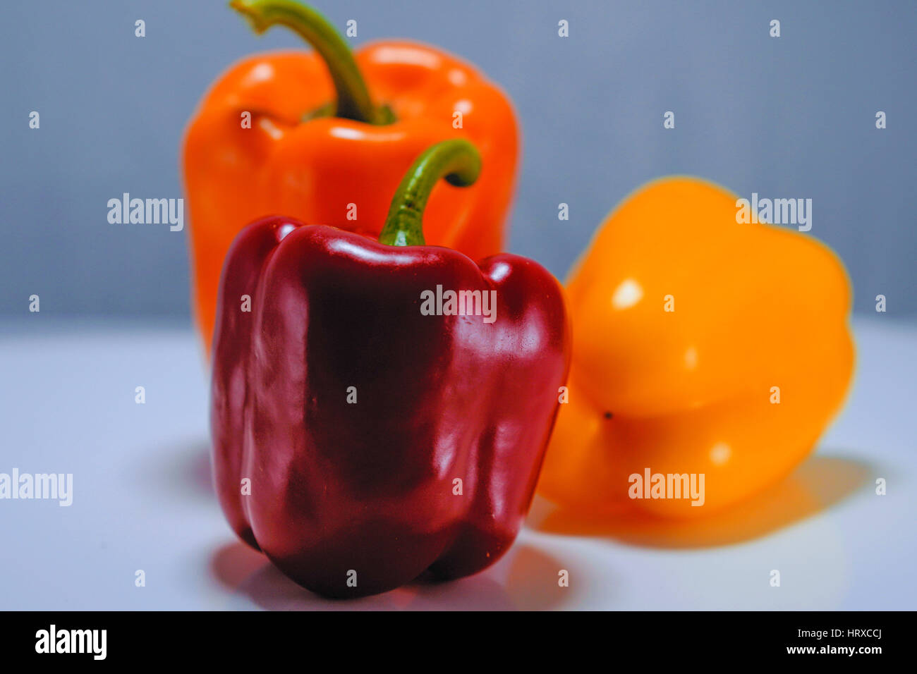 Close up shot of colorful bell peppers Stock Photo - Alamy