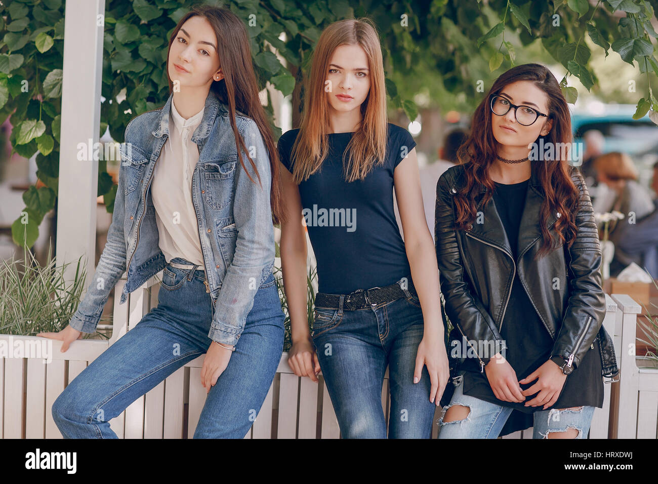 stylish young model walk in the street and pose for a photo on a Sunny ...
