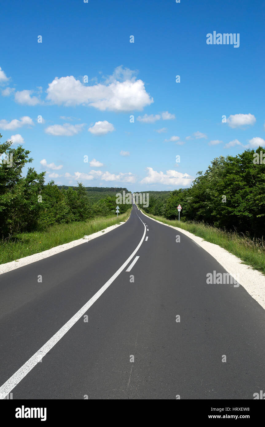 Highway across forest hi-res stock photography and images - Alamy