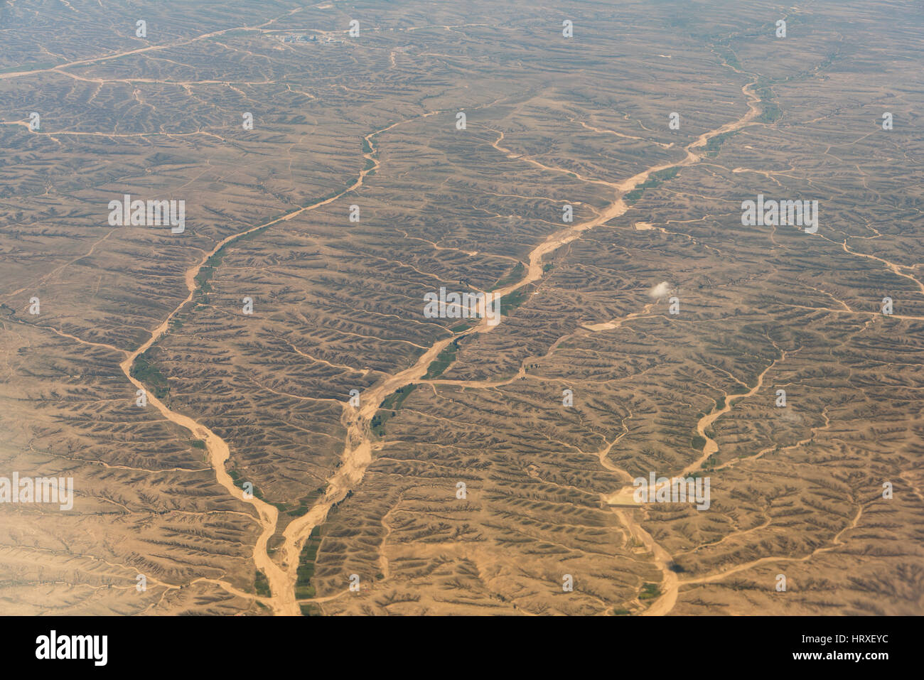 A arid landscape shows a dry river system Stock Photo - Alamy