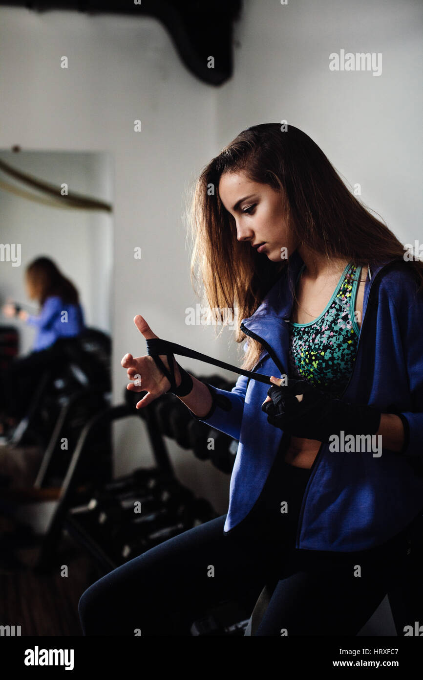 fight woman wrap hands for boxing. Fitness boxing model girl with hand ...