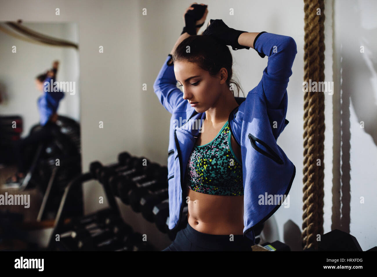 fighter woman wrap hands for boxing workout. Teenage girl getting ready ...