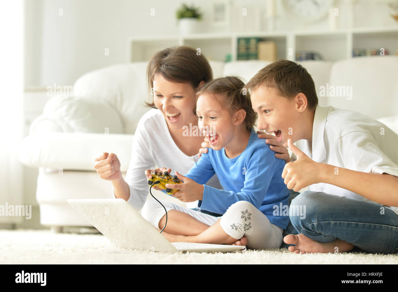family playing computer games, mother with kids Stock Photo - Alamy