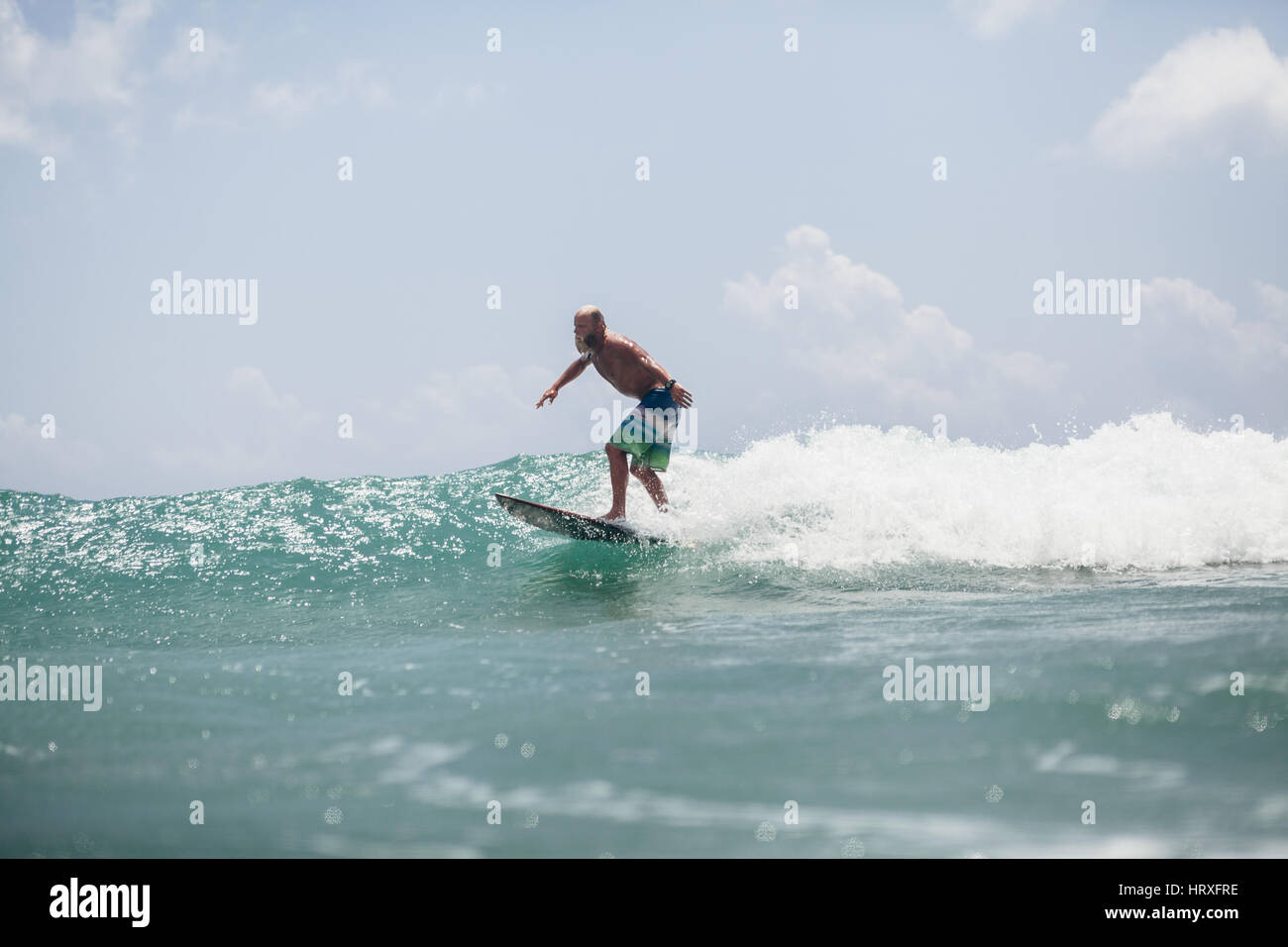 surfer man surfing on waves splash actively Stock Photo - Alamy