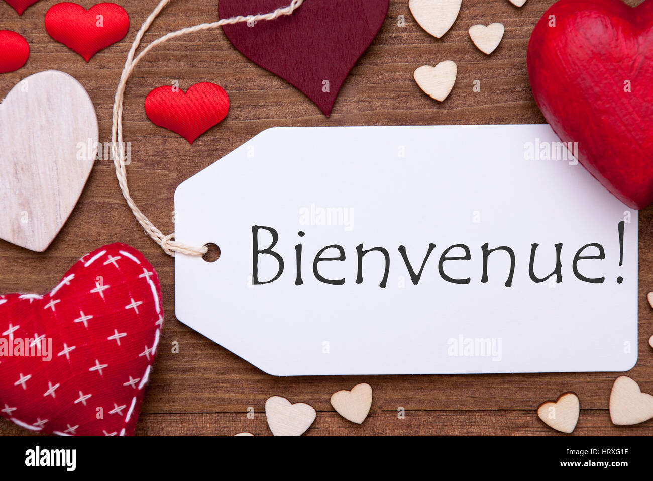 Label With French Text Bienvenue Means Welcome. Red Textile Hearts On ...