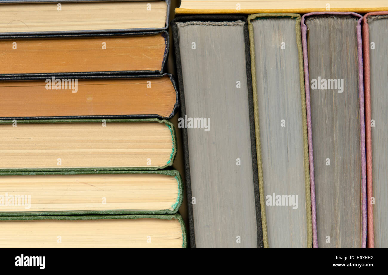 a stack of colorful books in a library or a room Stock Photo - Alamy