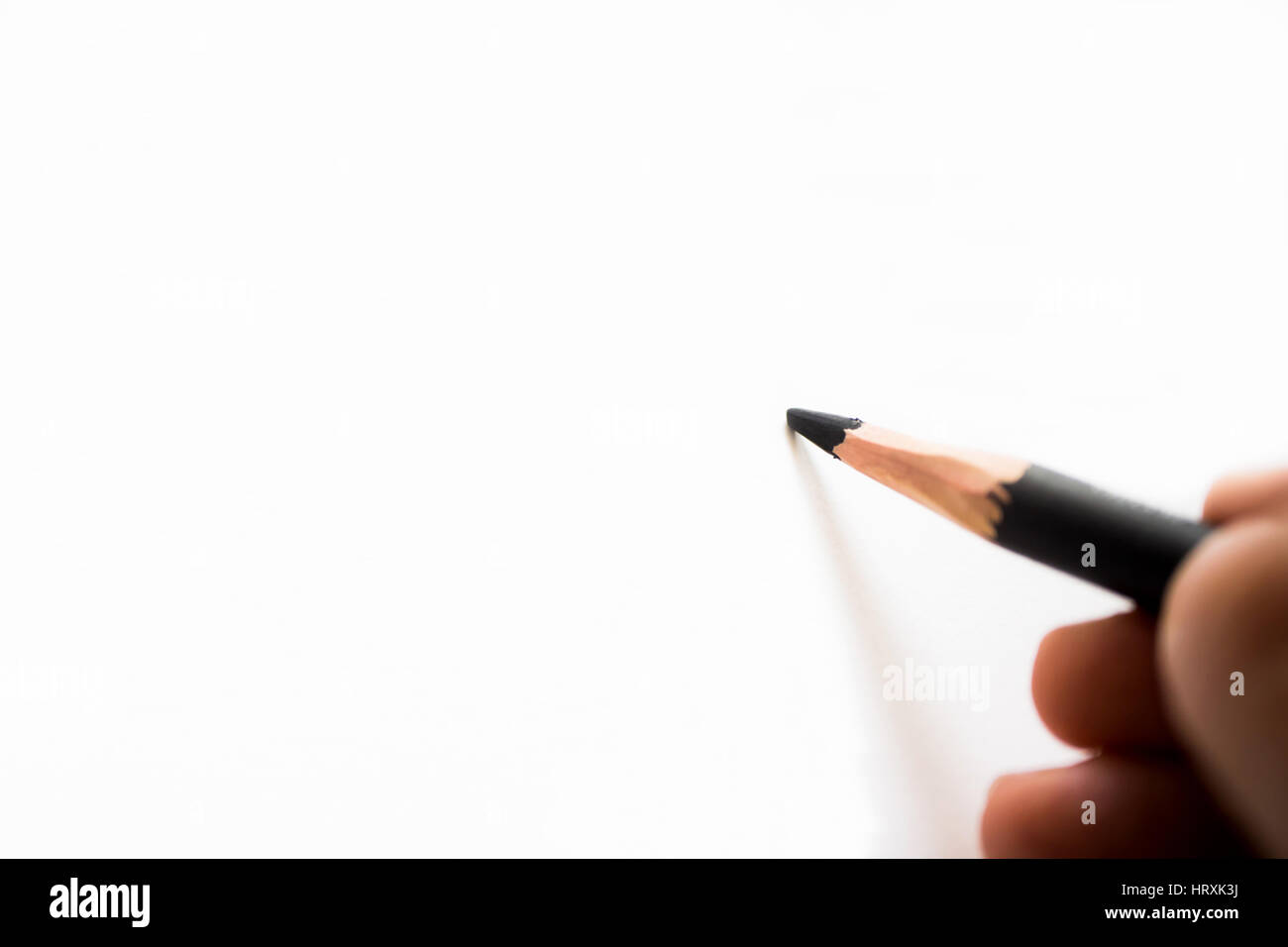 Pencil writing mark on white paper. Blurry focus Stock Photo - Alamy