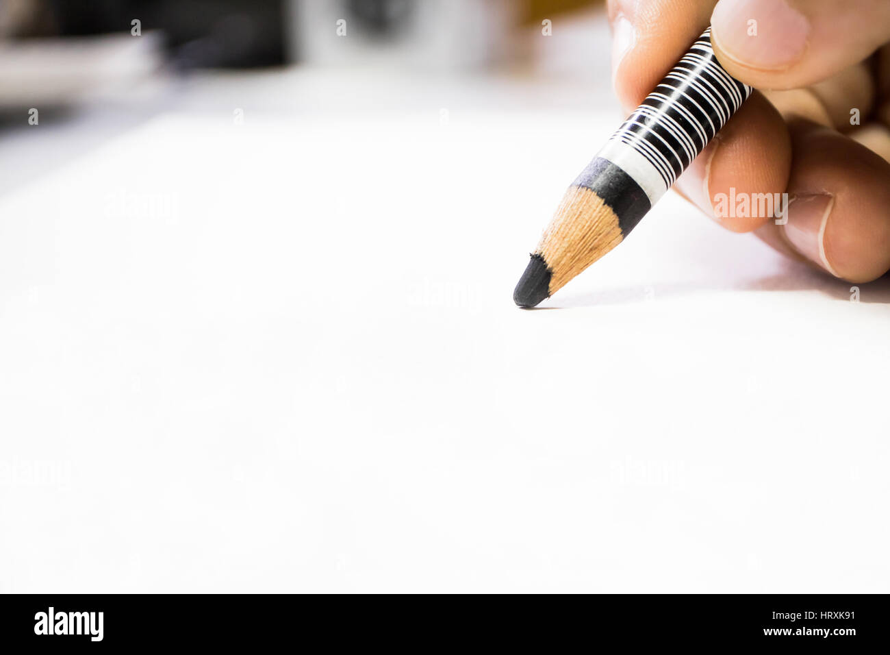 Hand holding pen closeup view Stock Photo - Alamy