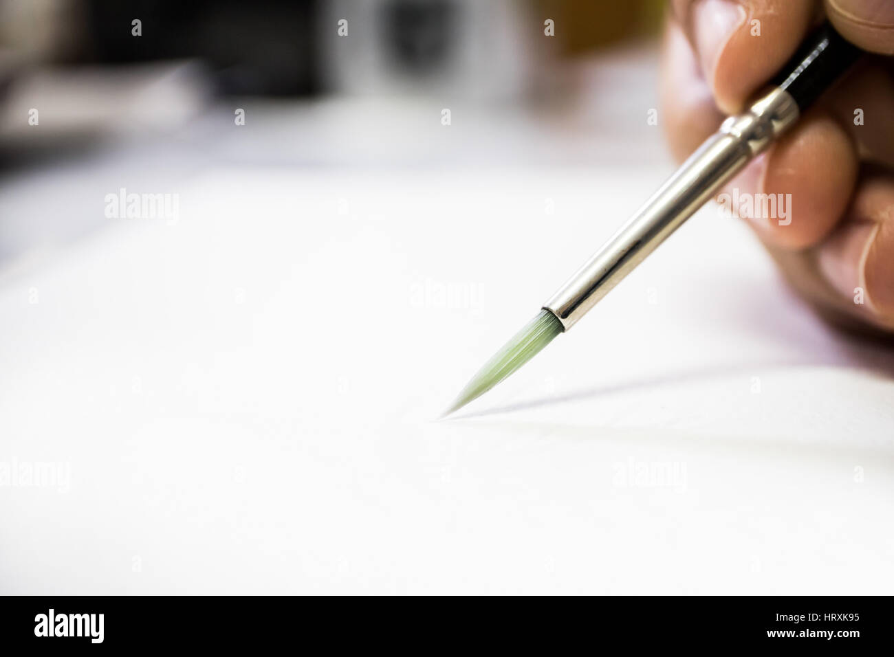 Hand holding pen closeup view Stock Photo - Alamy