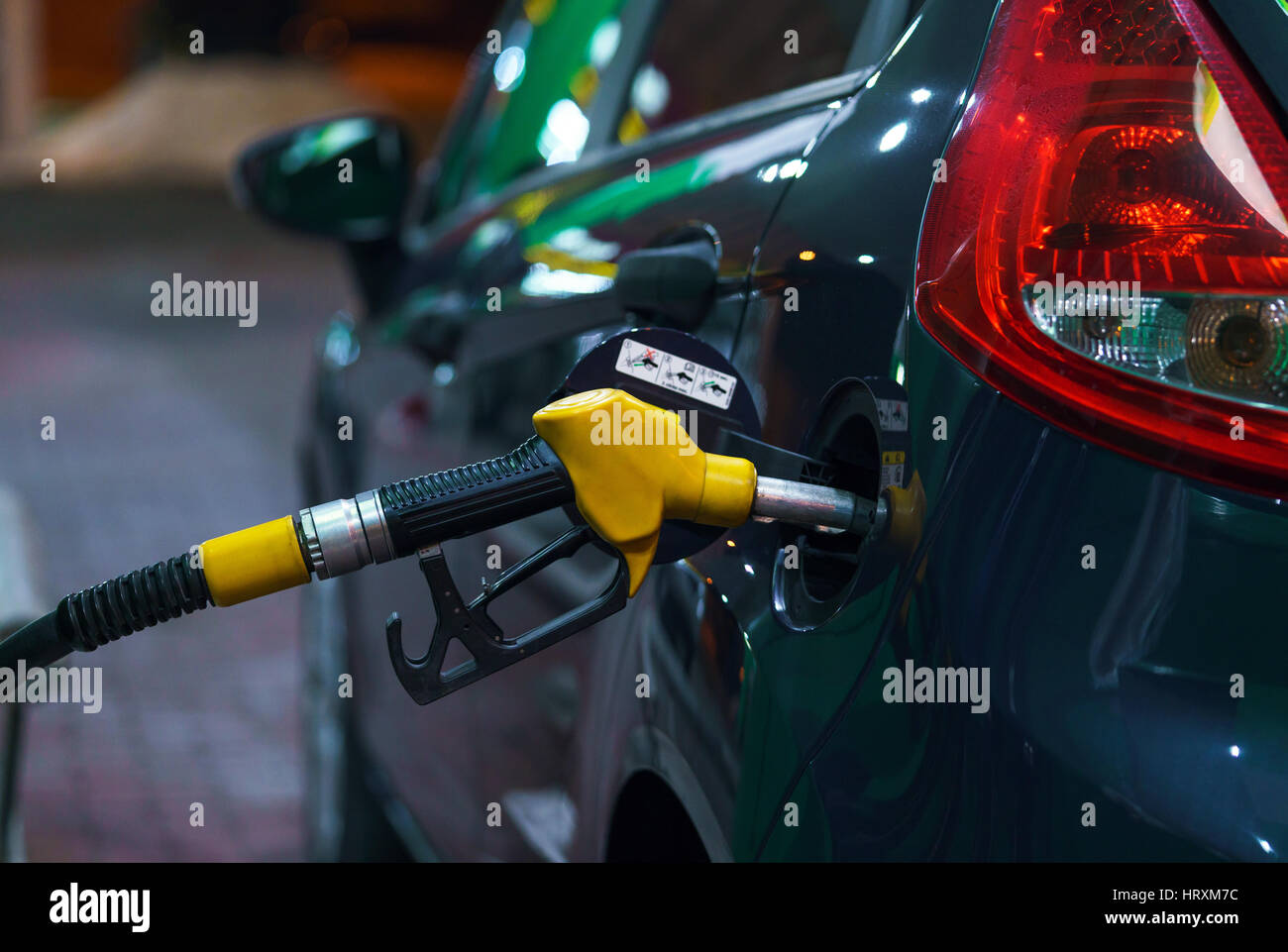 Car refueling on a petrol station at night closeup Stock Photo - Alamy