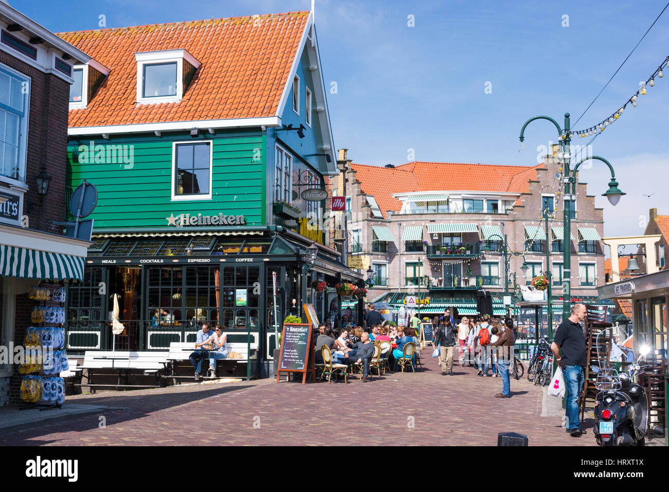 People enjoying outdoors dining in summer in Volendam, The Netherlands ...