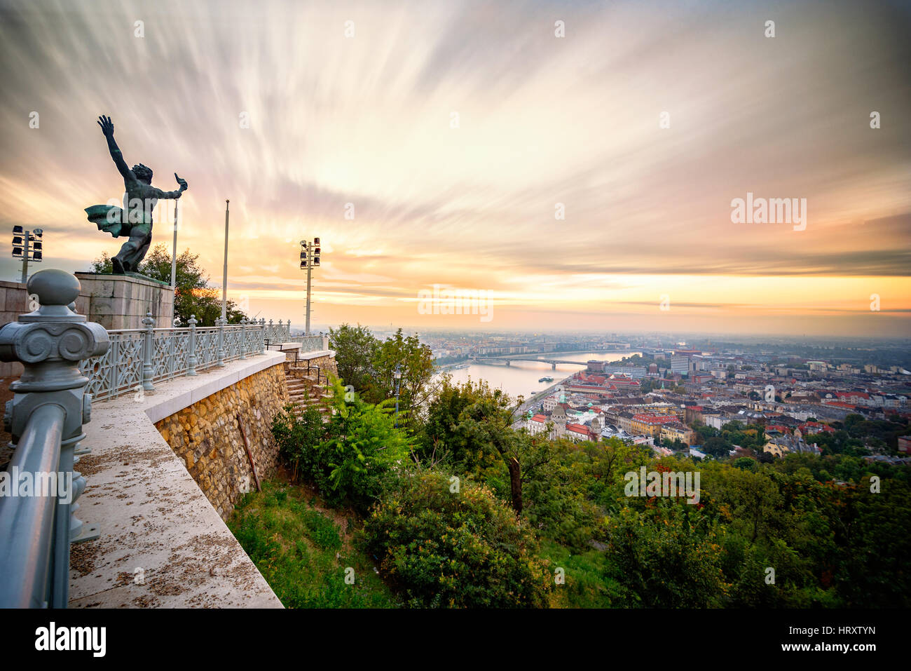 Statue during sunrise facing Danube River in Budapest Stock Photo - Alamy