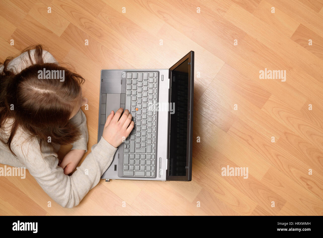Woman lying on floor laptop hi-res stock photography and images - Alamy