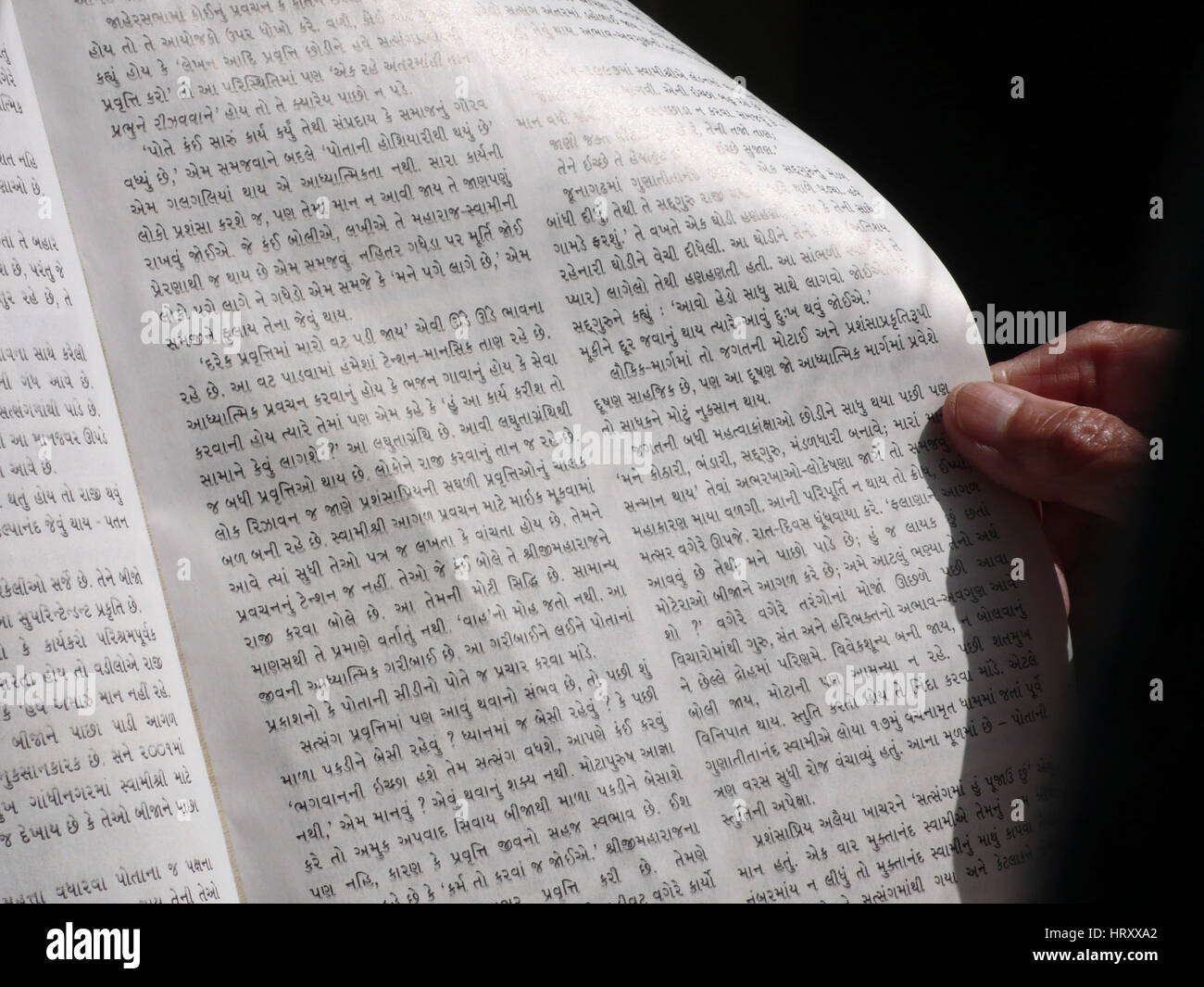 An old Indian lady reads urdu literature Stock Photo - Alamy