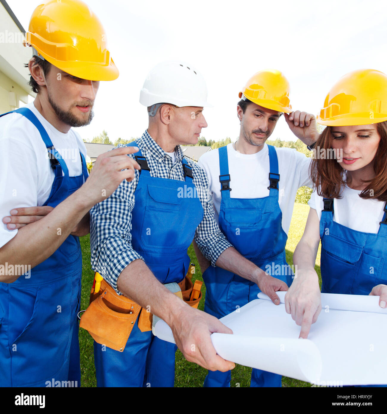 Overalls construction workers group hi-res stock photography and images ...
