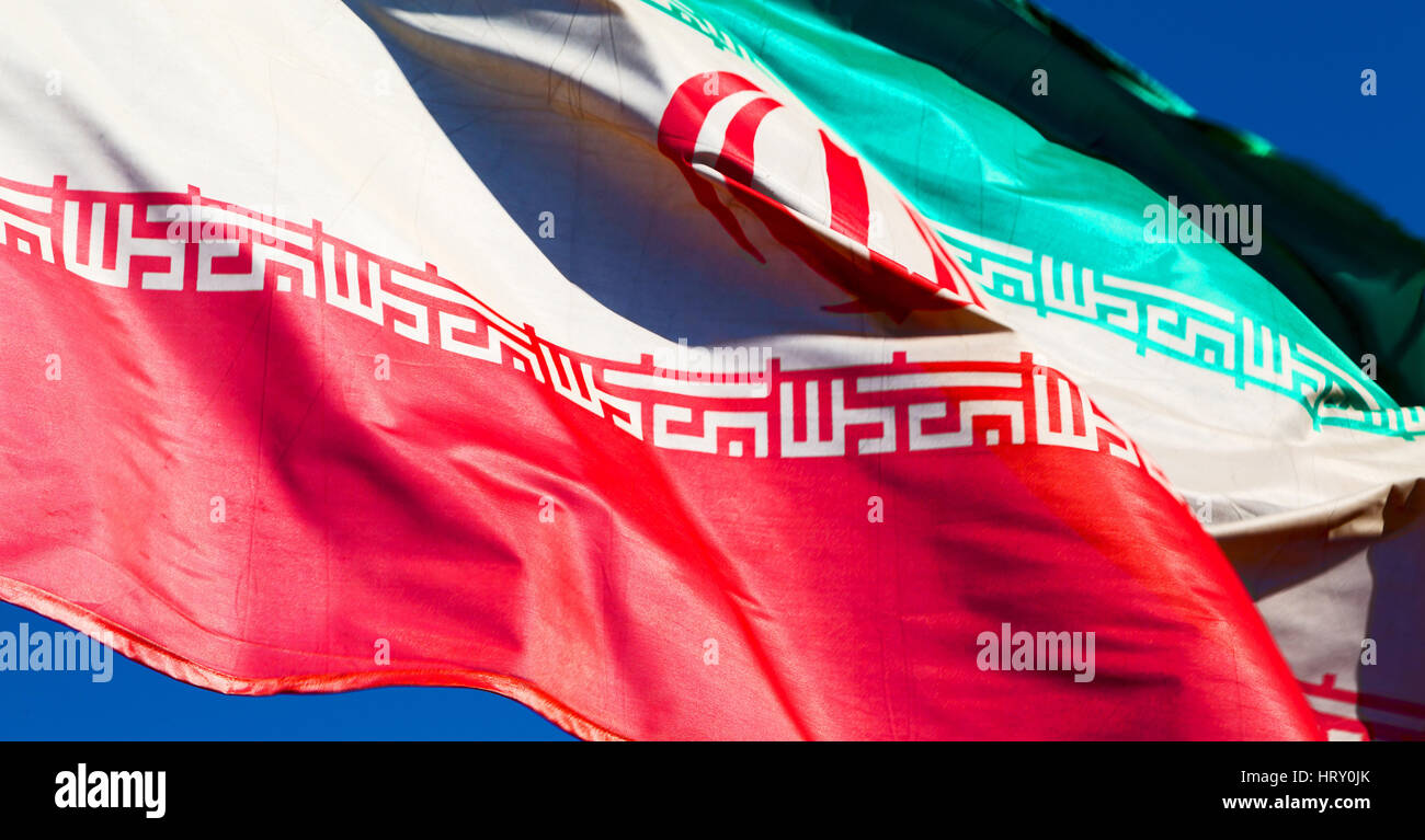 in iran blur iranian waving flag the blue sky and wind Stock Photo - Alamy