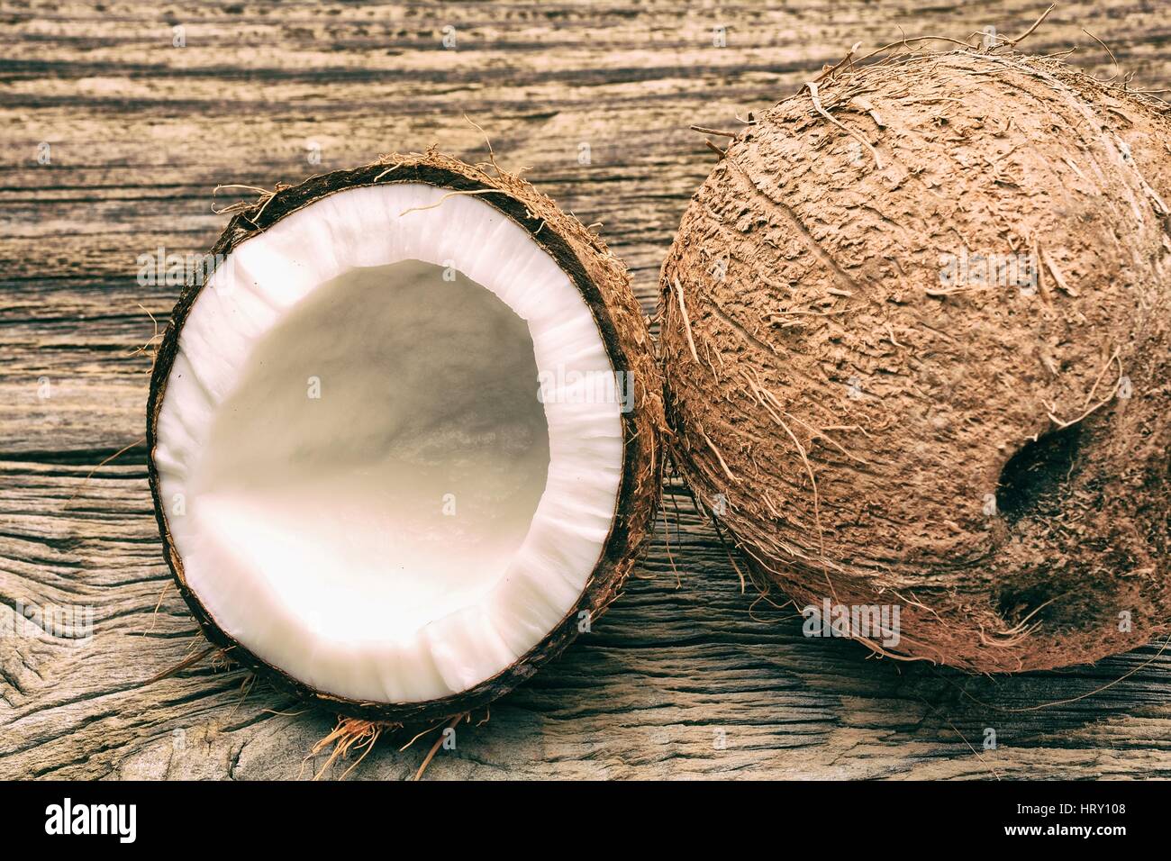 Fresh organic coconut on rustic wooden background Stock Photo - Alamy