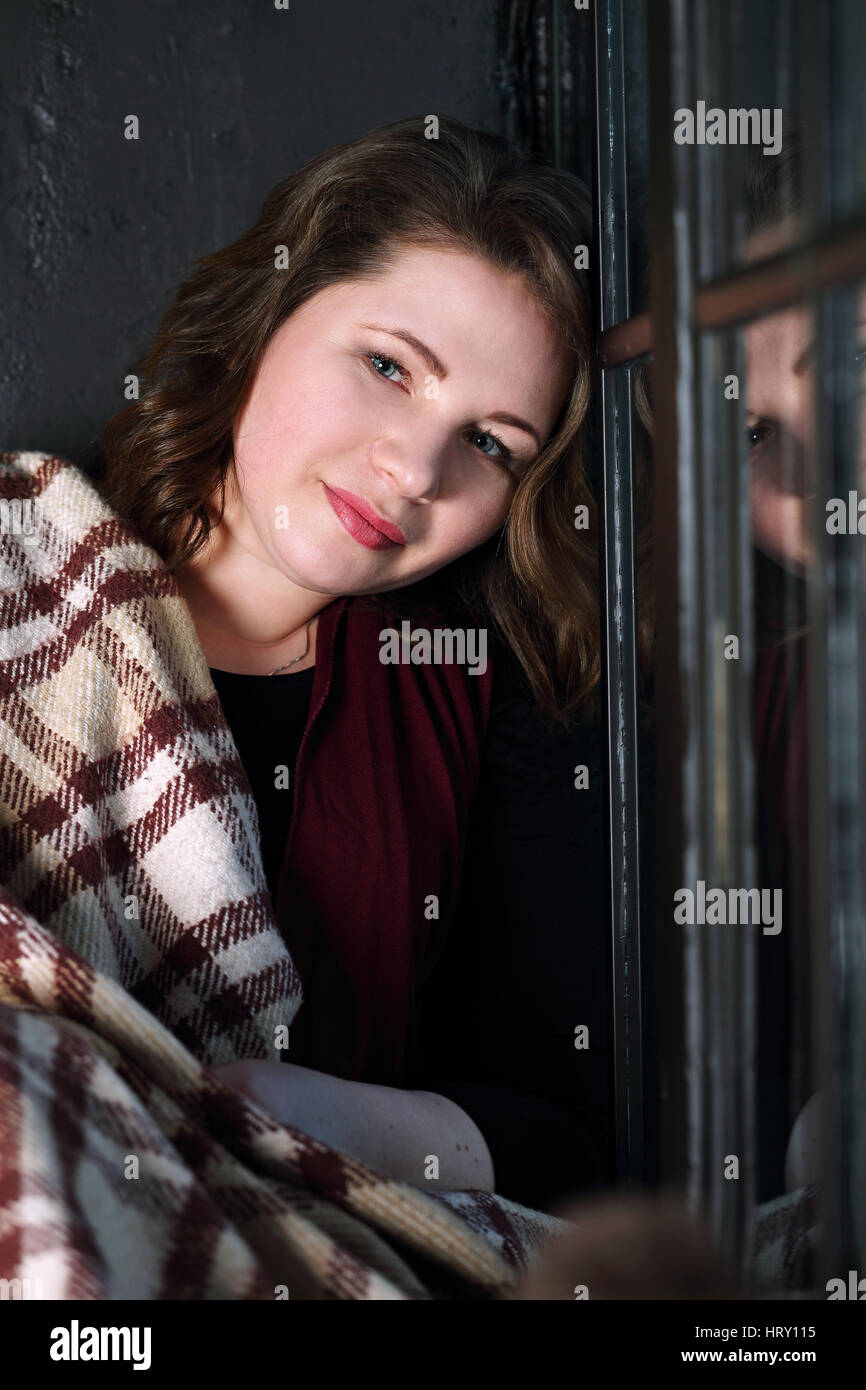 woman sitting by the window Stock Photo - Alamy