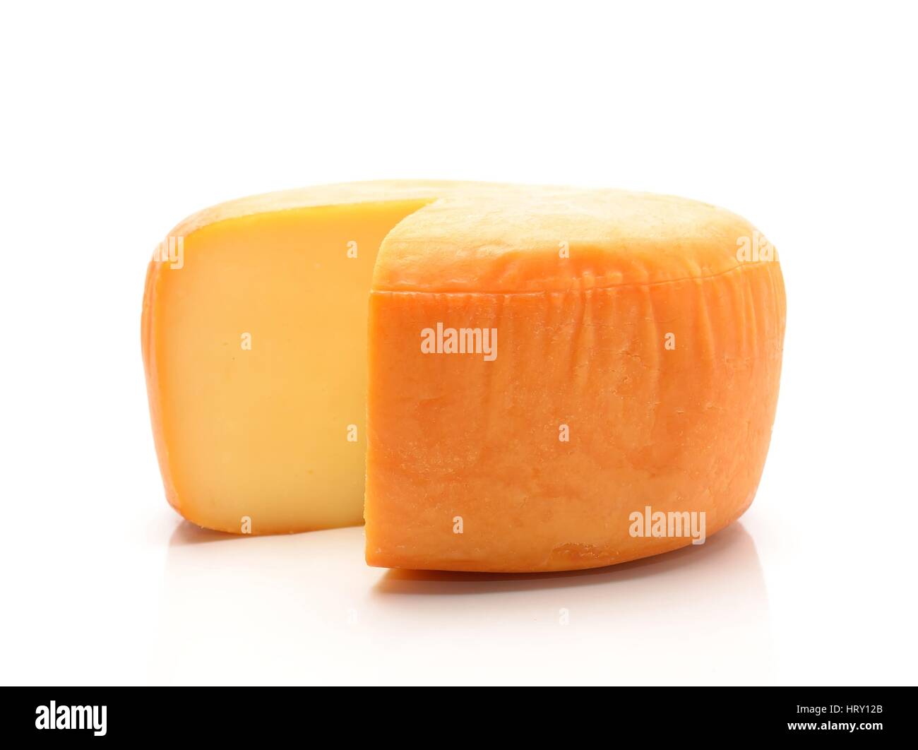 Wheel of traditional cheese isolated on white Stock Photo - Alamy