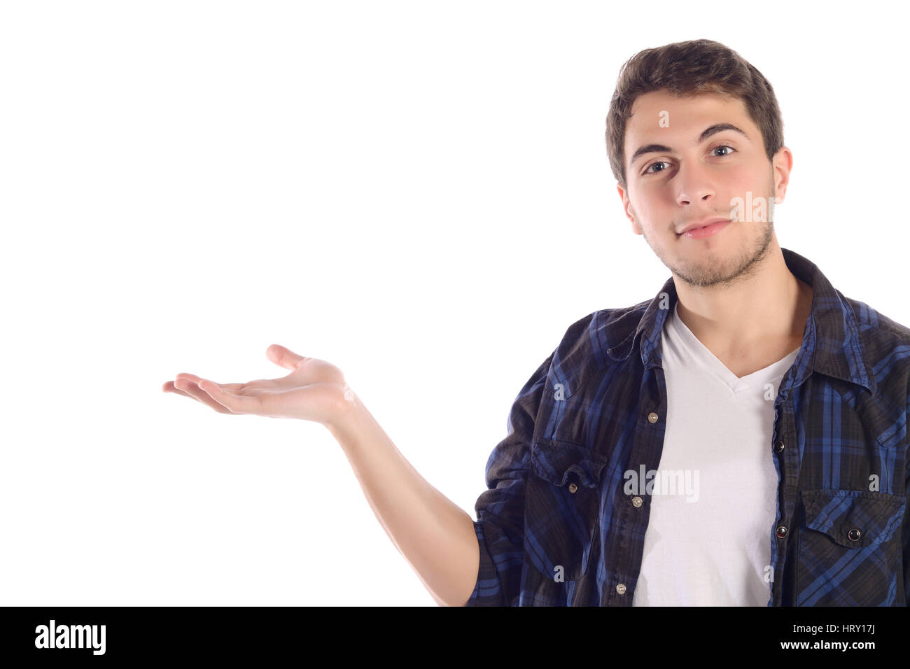Portrait of a young man showing something on palm. Isolated white ...