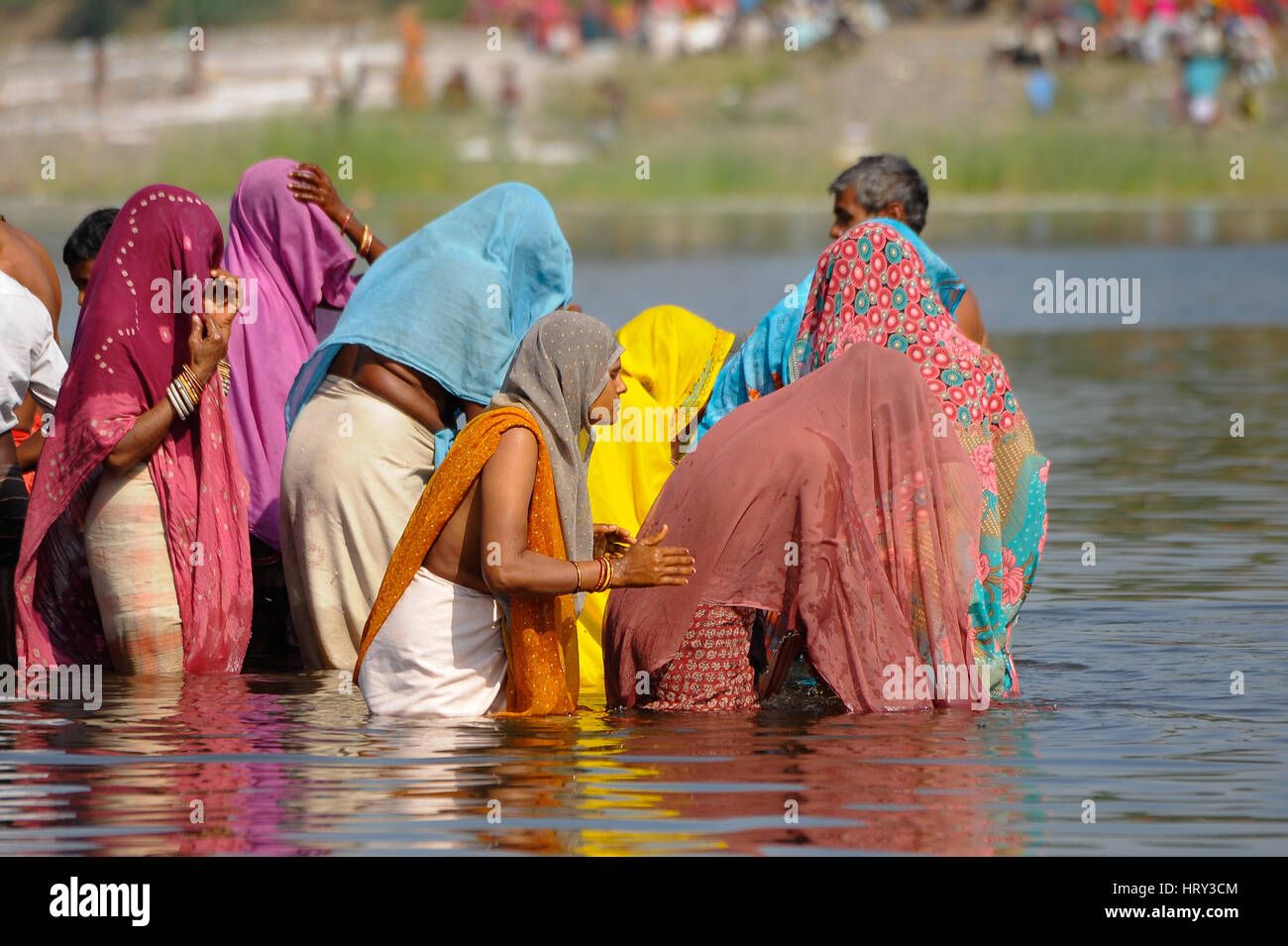 Bhil people gather in the waters during Baneshwar Mela Stock Photo - Alamy