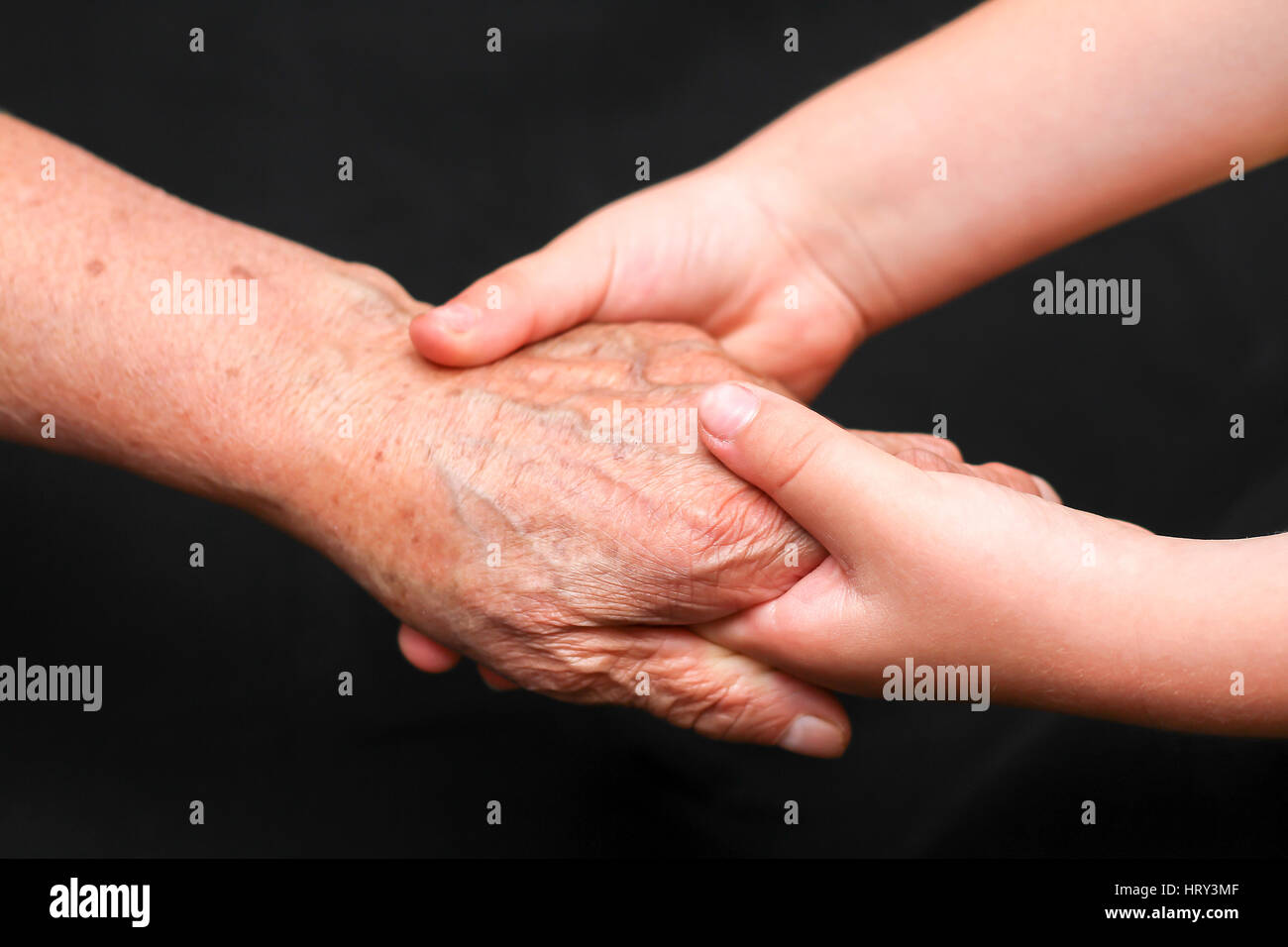 Old young hands touching hi-res stock photography and images - Alamy