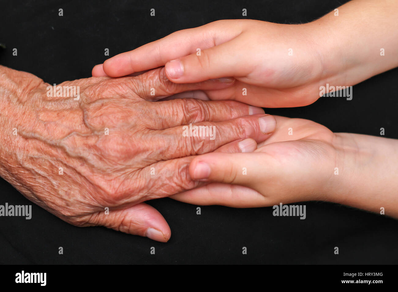 Old young hands touching hi-res stock photography and images - Alamy