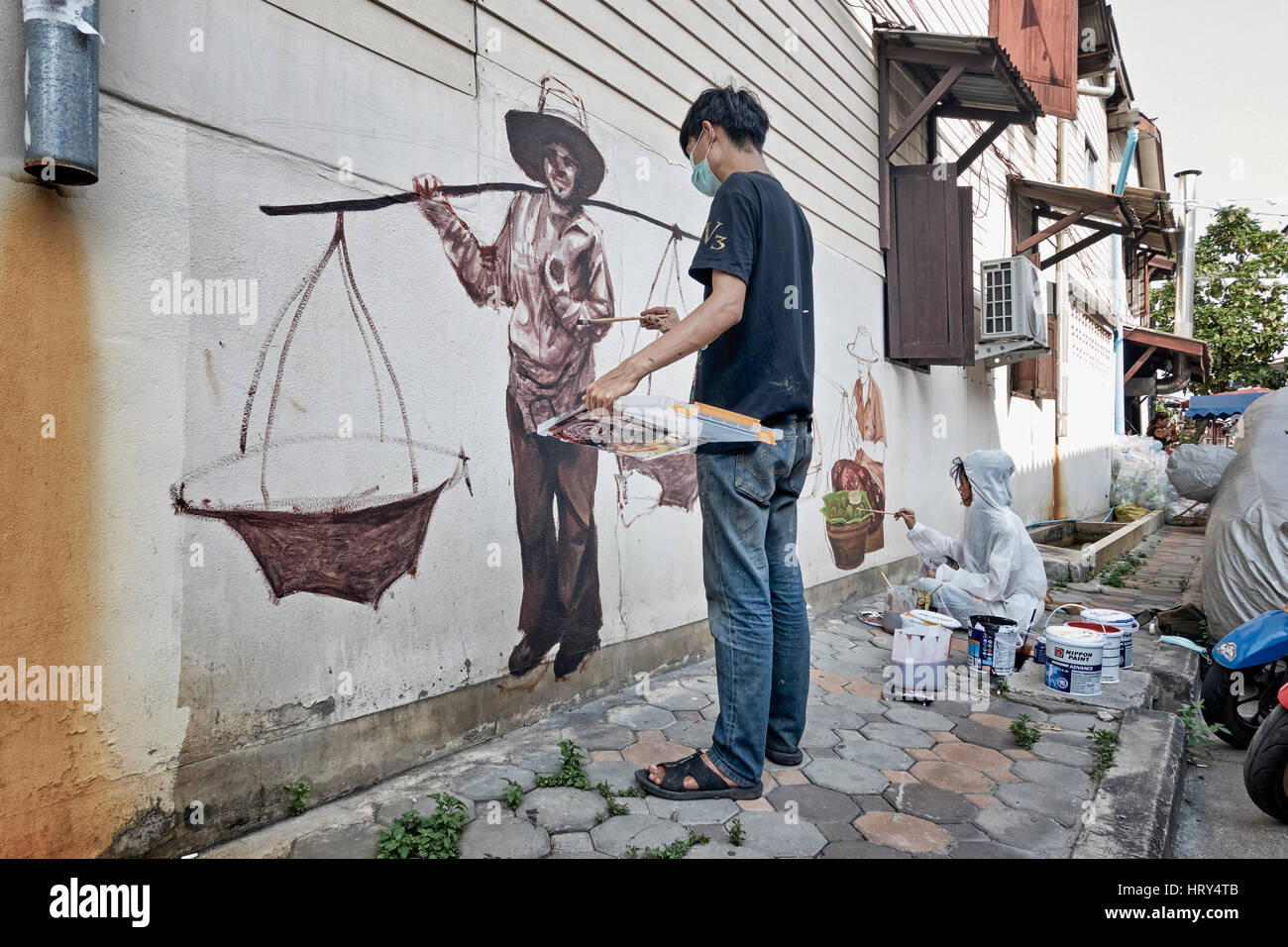 People Painting Street Walls