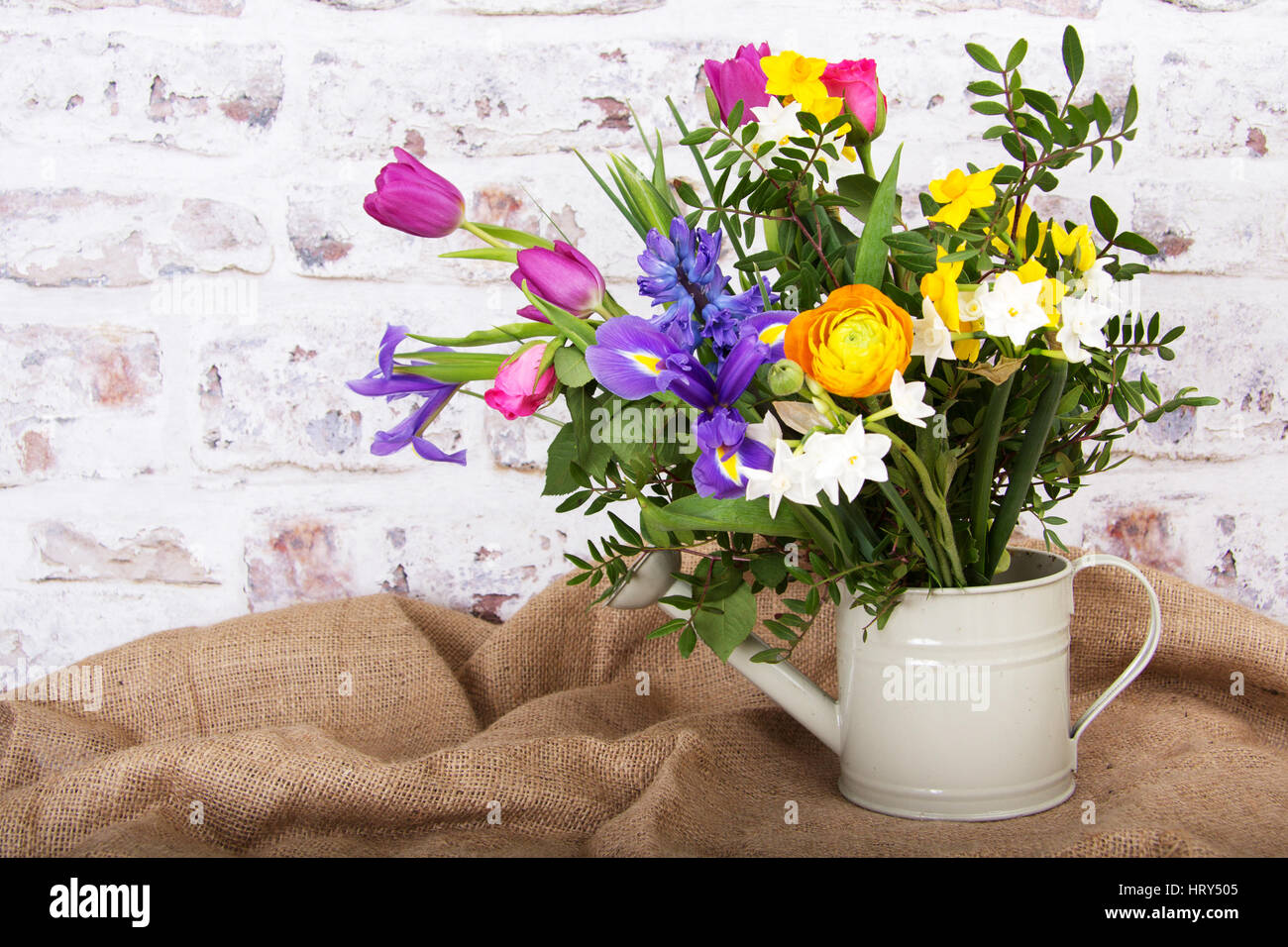 Spring cut flower arrangement against a rustic background Stock Photo ...